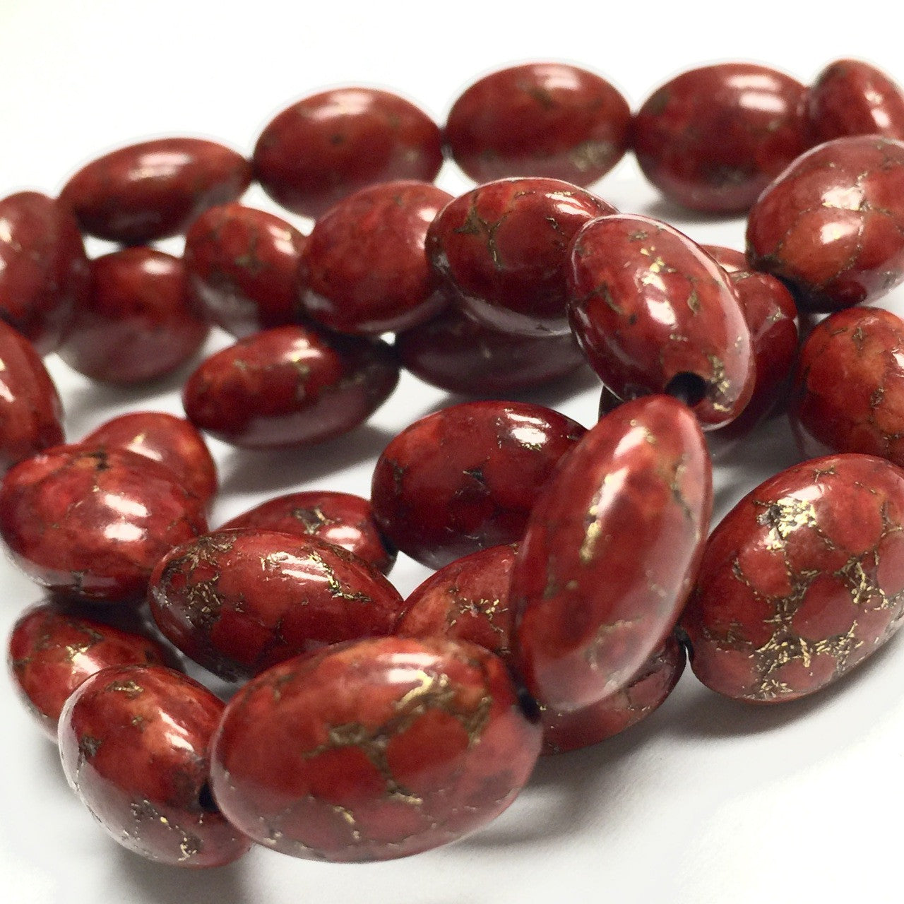Dyed Terra Cotta Turquoise with a Pyrite Matrix- Small Oval Beads